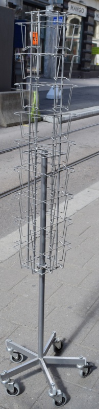 Solgt!Postkortstativ i metall på hjul.Høyde 180cm. 36 hyller.
